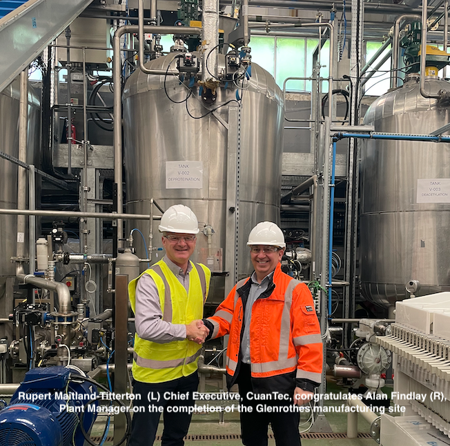 Rupert Maitland-Titterton congratulates ALan Findlay (R) Plant Manager ...