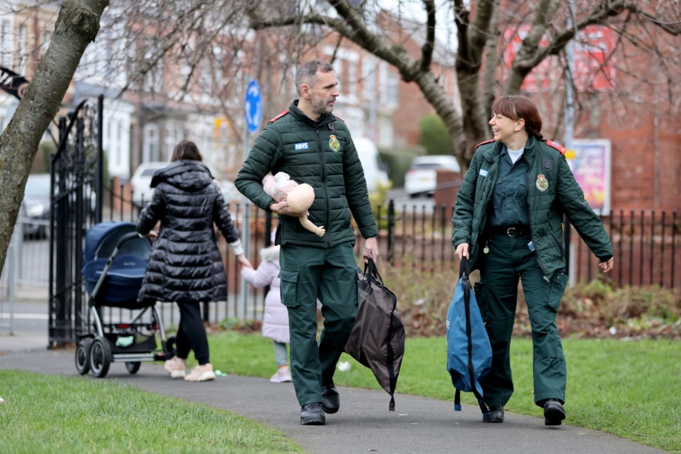 NEAS research team holding CPR training equipment | NE Ambulance ...