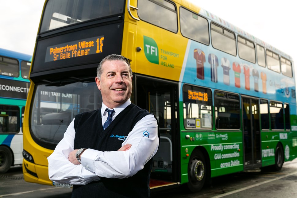 Male bus driver in front of Go-Ahead Ireland bus (10) | Go Ahead News