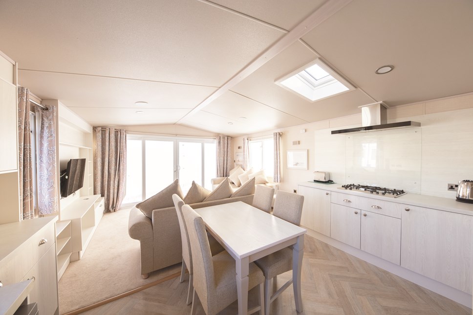 Gold caravan (two bed) dining area + kitchen | Haven News