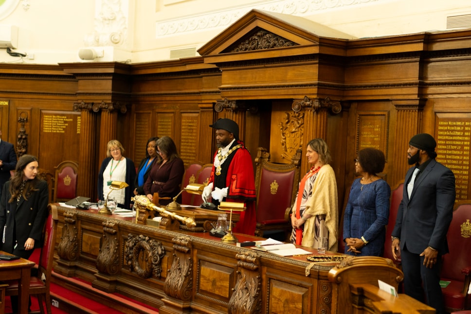 Mayor of Islington, Cllr Jason Jackson standing in the Council Chamber ...