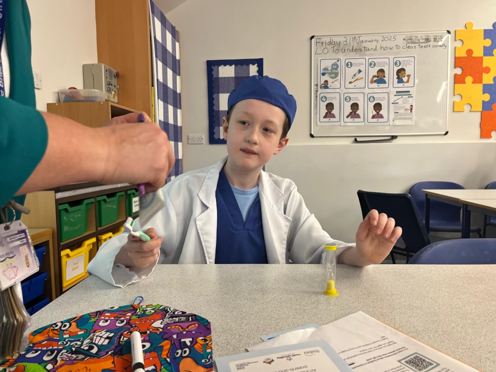Brier School pupil Logan Weaver trying out one of the toothbrush packs ...