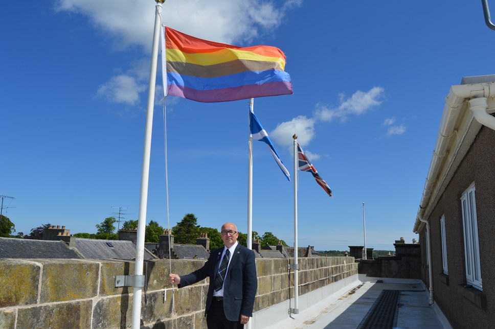 Pride flag raised by Convener Cllr Marc Macrae | Moray Council News