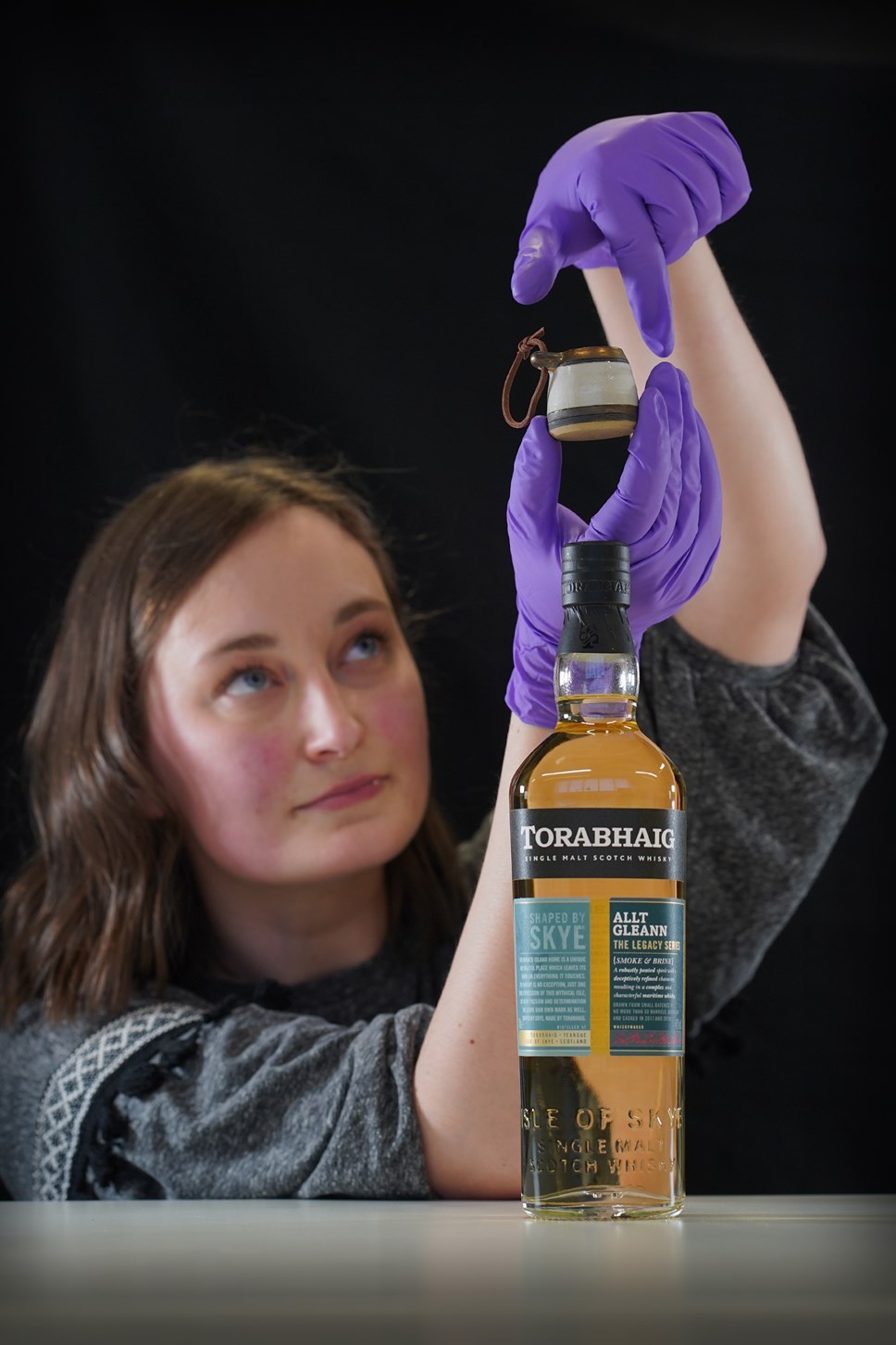 Doctoral Researcher Laura Scobie, with a ceramic measure created by ...