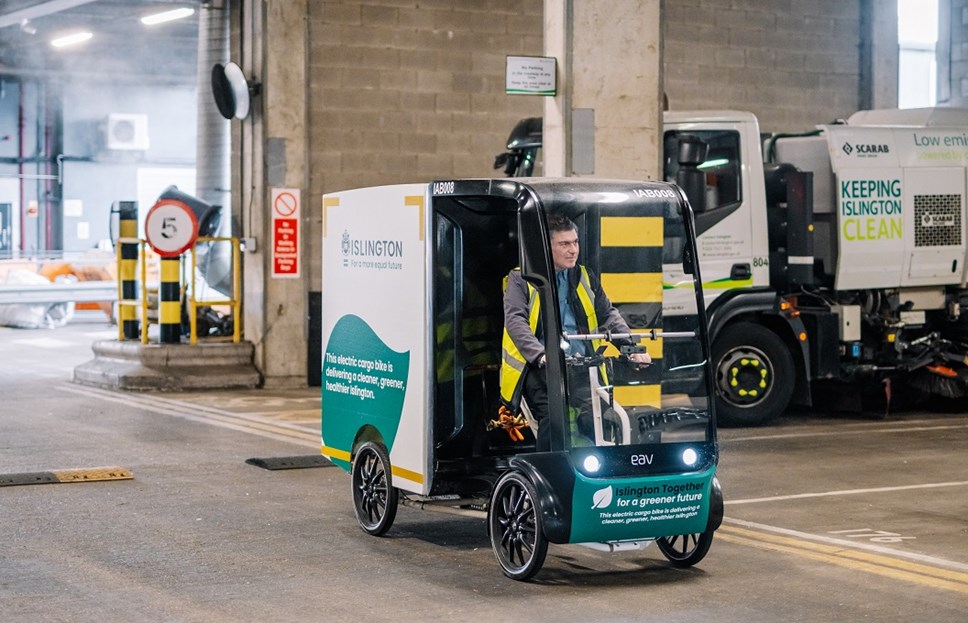 A member of staff uses an electric cargo bike at Islington's Waste and ...