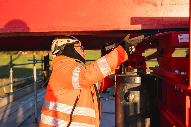 Specialist engineer from Eiffage Metal feeding a teflon pad into ...